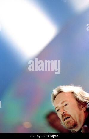 The Italian singer-songwriter Umberto Tozzi holding a horse by the ...