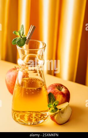 Glass of apple juice and ripe apples on a kitchen table Stock Photo - Alamy