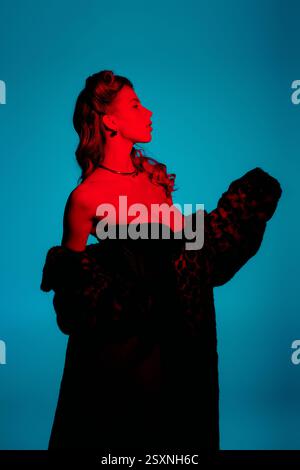 Chic young woman confidently showcases stylish attire and trendy ...