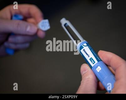 A package of Ozempic injection solution and injection pen with four ...