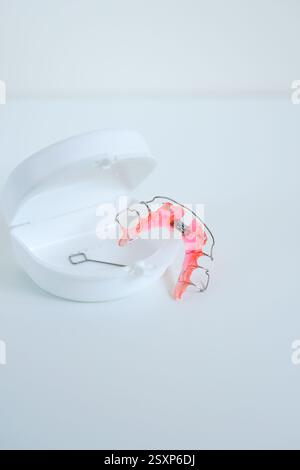An orthodontic palatal expander with an adjustment key in a white ...