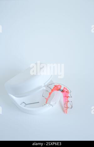 An orthodontic palatal expander with an adjustment key in a white ...