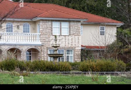 Facade of a beautiful residential house with a tiled roof Stock Photo ...