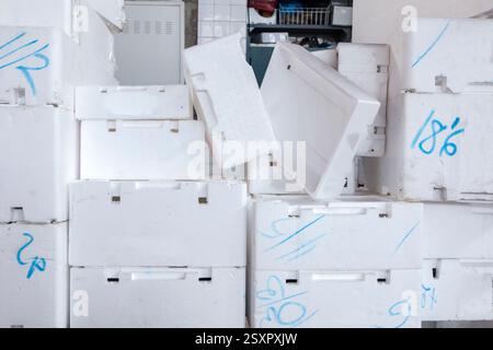 White expanded polystyrene boxes pilled at wholesale market. Fish ...