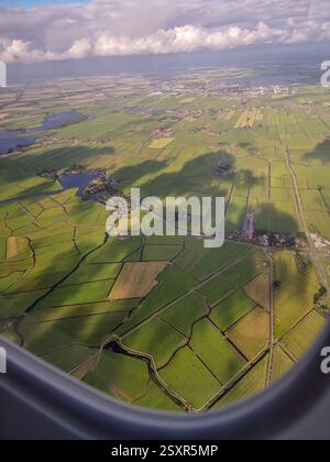 Aerial view on green polders, meadows and water transportion channel in ...