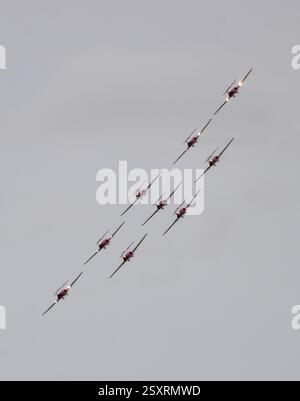 View of nine airplanes flying in the sky with red, green and white ...