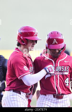 February 25, 2025: Razorback catcher Ryder Helfrick (27) speaks with ...
