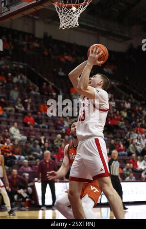 Louisville forward Noah Waterman (93) backs into the lane against ...