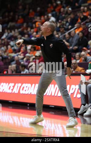Louisville head coach Pat Kelsey, right, argues with a game official ...