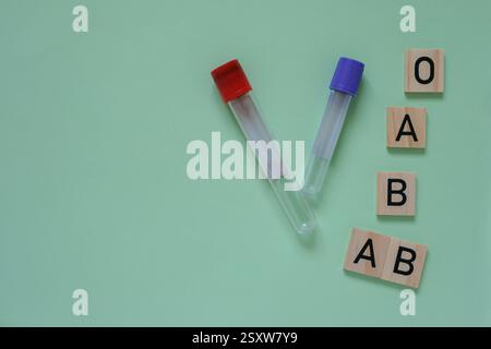 Test tubes with red and purple plugs. Wooden cubes with letters ...