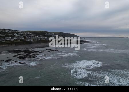 Aerial captures at the shoreline of Downderry beach in Cornwall UK ...