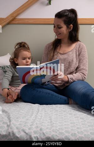 A Special Storytime Moment Between Mom and Daughter Stock Photo - Alamy