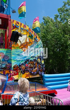Local carnival signs and rides Stock Photo - Alamy