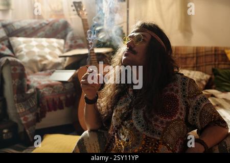 Relaxing in a Bohemian Room Smoking and Reflecting Stock Photo - Alamy