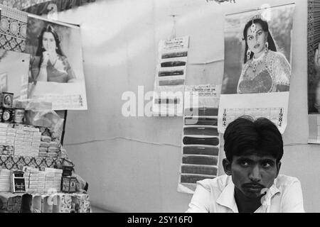 Man and bollywood calendar, Vautha fair, Gujarat, India, 1983 Stock ...