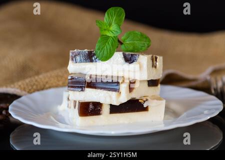 coffee jelly pieces inside white milk jelly Stock Photo - Alamy