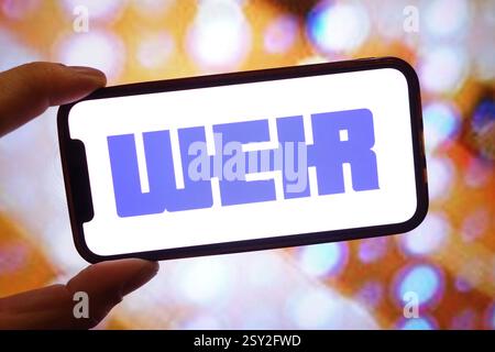 Weir Group plc company logo seen displayed on smart phone Stock Photo ...