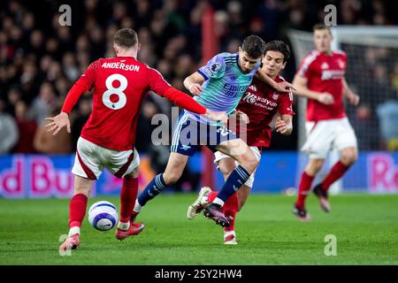Elliot Anderson of Nottingham Forest is tackled by Noah Okafor of Leeds ...