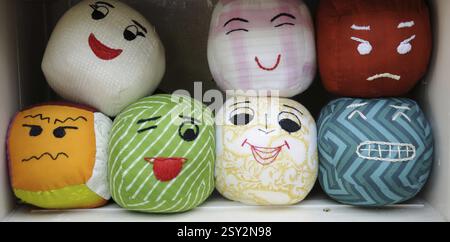 Lots of handmade colored smiley faces soft toys, handmade colored ...