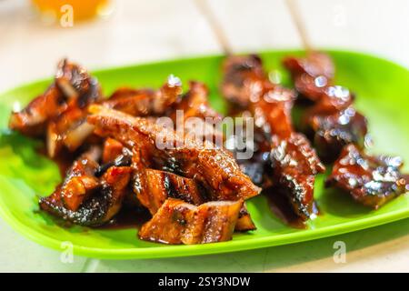 A serving of sliced grilled pork at a local grill restaurant in Bohol ...