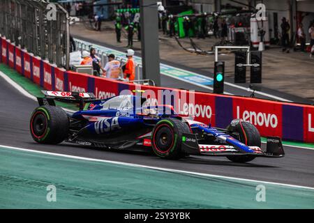 Visa Cash App RB Formula One Team engineers and VCARB 02 in the garage ...
