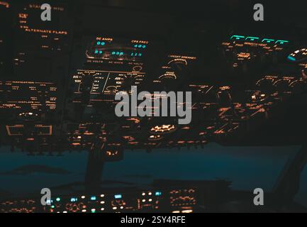 Cockpit view of an airplane during a night-time flight with illuminated ...