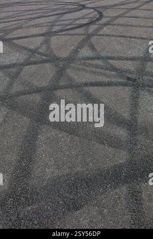 Closeup of burned rubber tire tracks on asphalt Stock Photo - Alamy