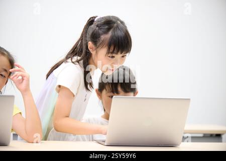 Japanese kids using laptops Stock Photo - Alamy