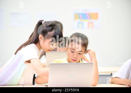 Japanese kids using laptops Stock Photo - Alamy