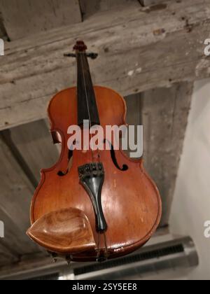 a violin, a wooden string instrument played with a bow violin, a wooden ...