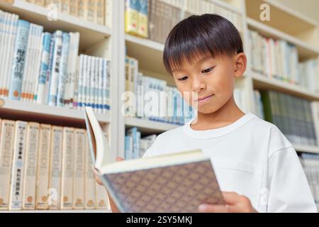 Japanese Kid In School Library Stock Photo - Alamy