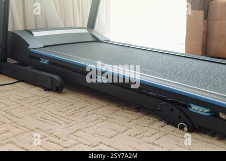 Treadmill in the room. Home workouts. Home gym Stock Photo - Alamy