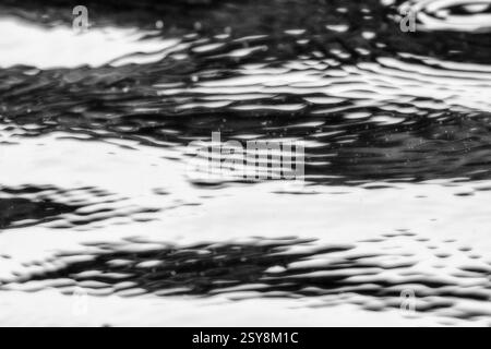 Texture of water with ripples on light background, closeup Stock Photo ...