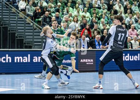 Peter Walz (ThSV Eisenach, #14) in a duel with Marek Nissen (HC ...
