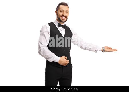 Waiter smiling and gesturing welcome into a restaurant isolated on ...