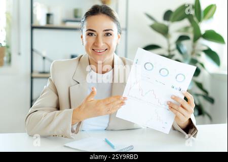 Successful positive business woman presenting new business projects to ...
