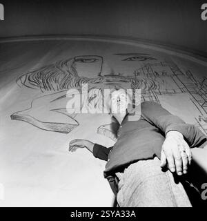 Romanian artist Mihu Vulcanescu (1937- 1994) working on a mural inside ...