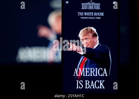 A smartphone screen displays The white house website with an image of ...