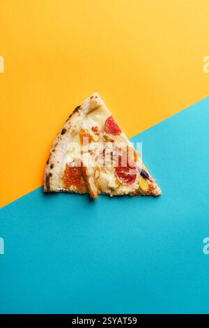 Bright yellow creamy cheese sauce in elegant white triangular bowl on ...