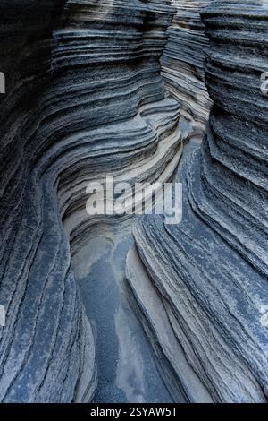A textured rock formation showcasing intricate lines and patterns that ...