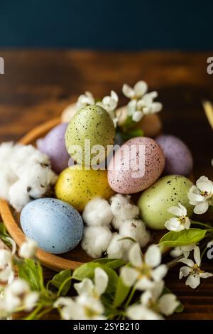 Easter flower arrangement with colorful speckled eggs daisy flowers and ...