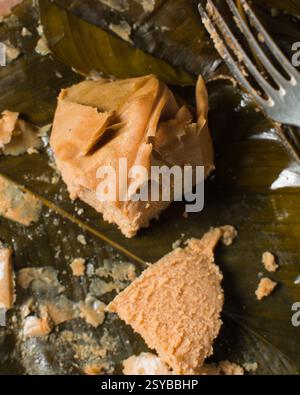 Overhead of moi moi in leaf on a plate, top view of nigerian bean ...