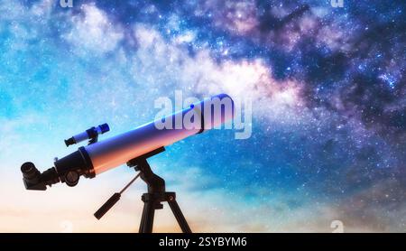 White telescope on tripod pointing at a starry sky at dusk. Side view ...