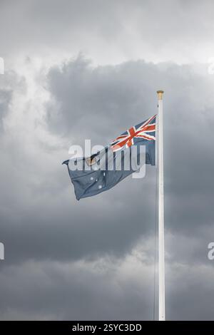 Waving flag of Victoria is a state of Australia on flagpole with sky ...