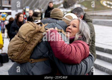Mother Leslie Hertweck hugging friends of her son at memorial service ...