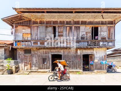 A traditional thatched house in the Philippines made almost entirely of ...