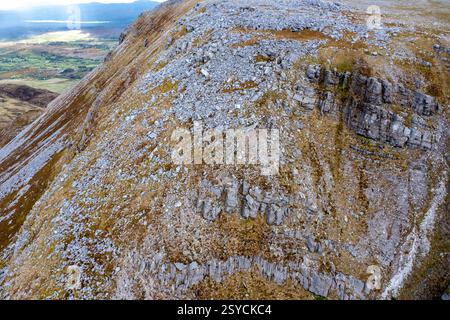 Aerial view of the Muckish mountain and the trail called miners path in ...
