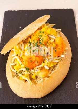 Tapa made of gulas, prawns and eggs in bread. Spain Stock Photo - Alamy