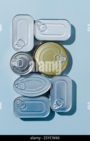 high angle view of some unopened cans, with different shapes and sizes ...