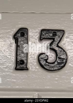 A closeup of sign number thirteen in blue and white outdoors Stock ...